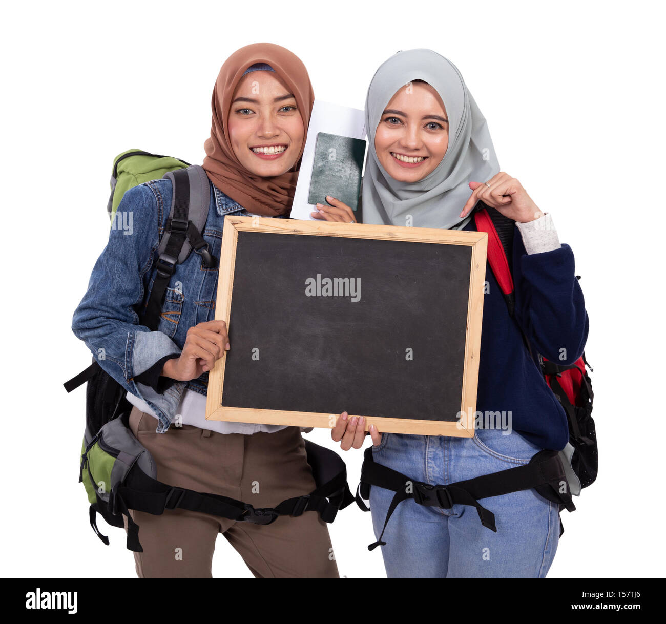 two muslim woman backpacker with blackboard Stock Photo - Alamy