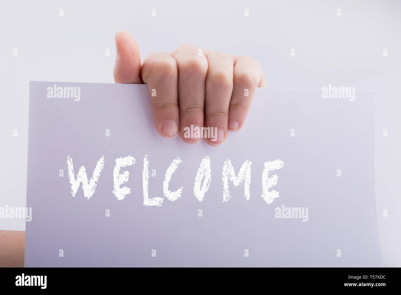 Hand holding welcome word on a white background Stock Photo - Alamy