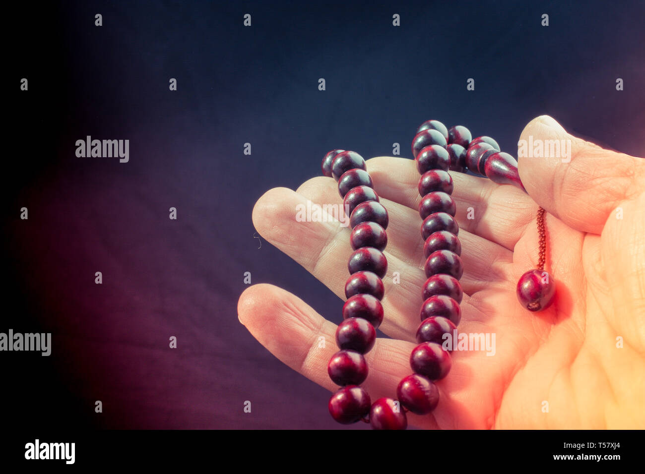 Set of some praying beads of various colors in hand Stock Photo - Alamy