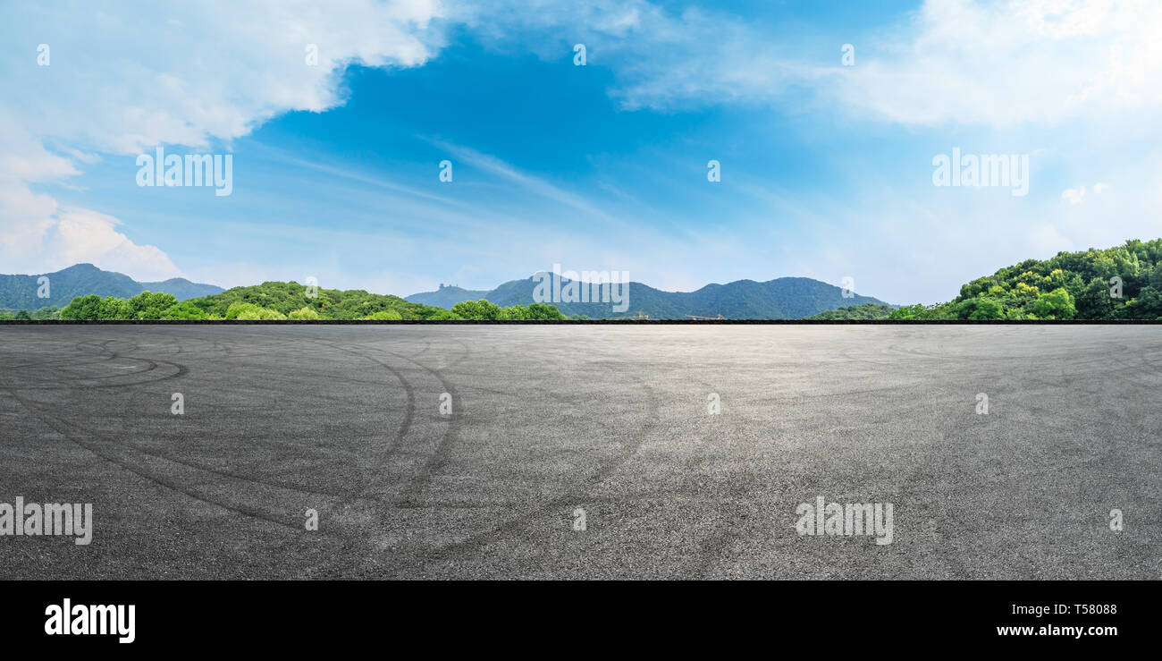 Asphalt race track ground and mountains with blue sky landscape Stock ...