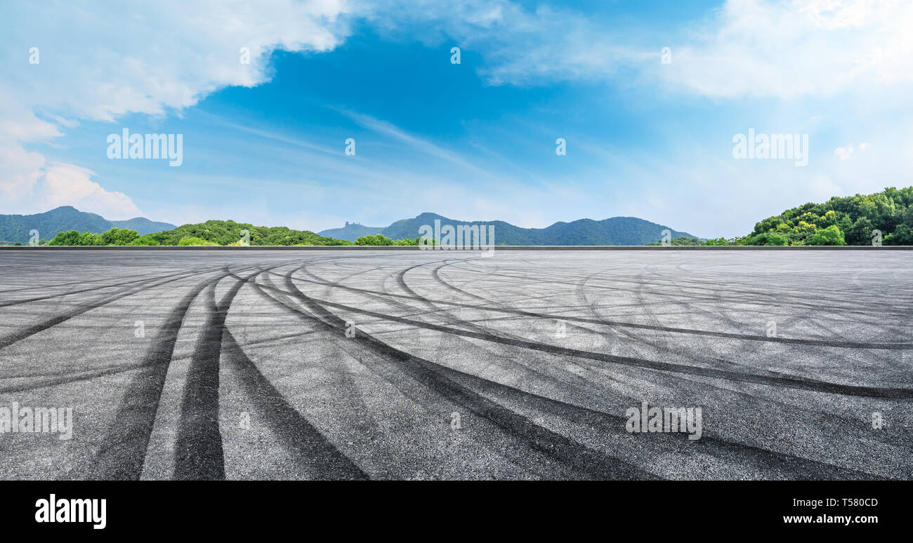 Asphalt race track ground and mountains with blue sky landscape Stock ...