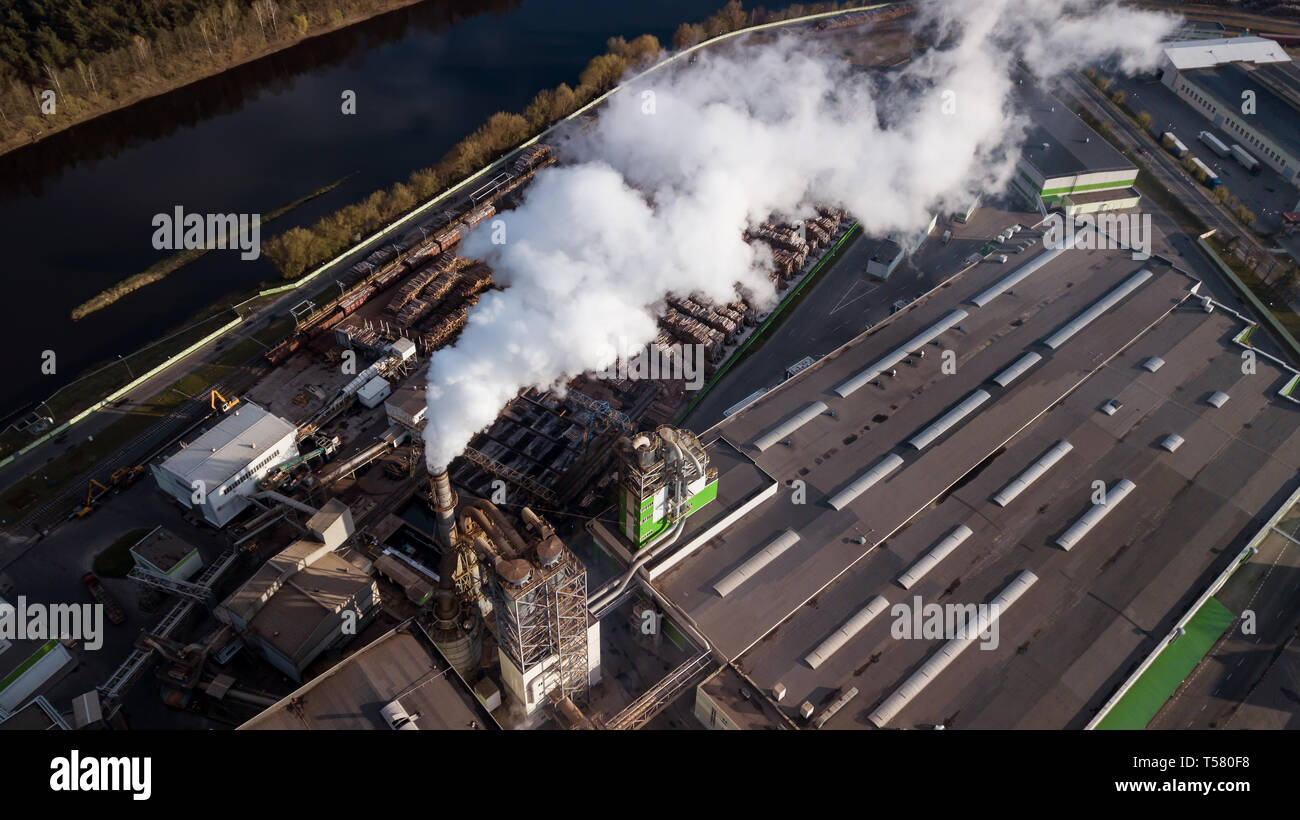 Aerial photography factory for processing wood. The smoke from the ...