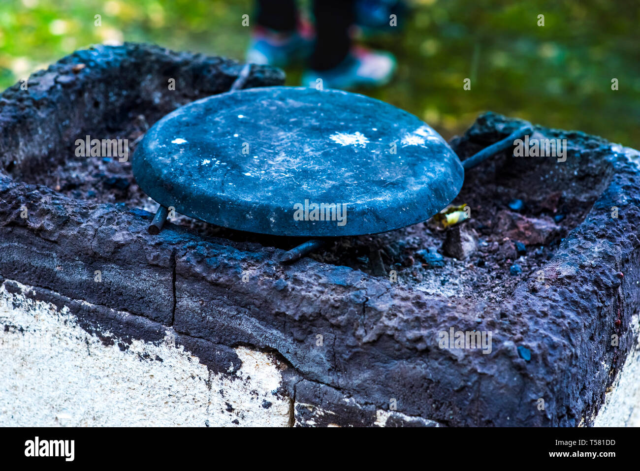 vintage stone tilesfor cooking in nature at the stake Stock Photo - Alamy