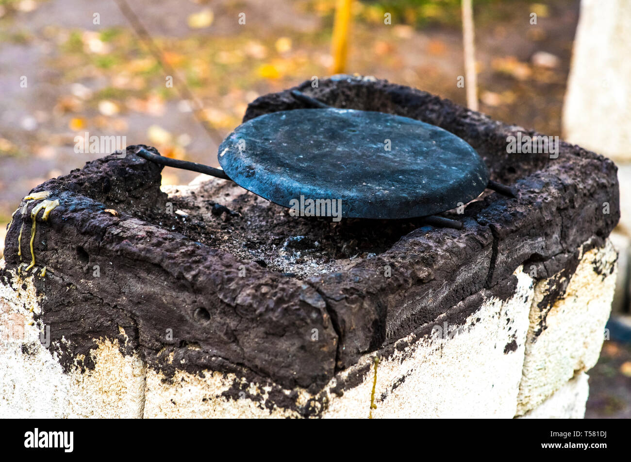vintage stone tilesfor cooking in nature at the stake Stock Photo - Alamy