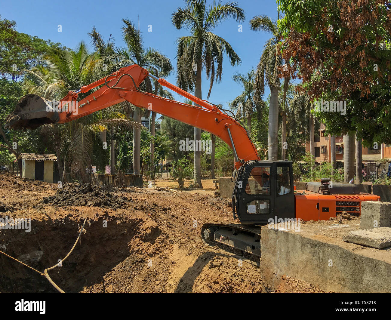 17-Apr-2019-red caterpillar driven hydraulic excavator working site of ...