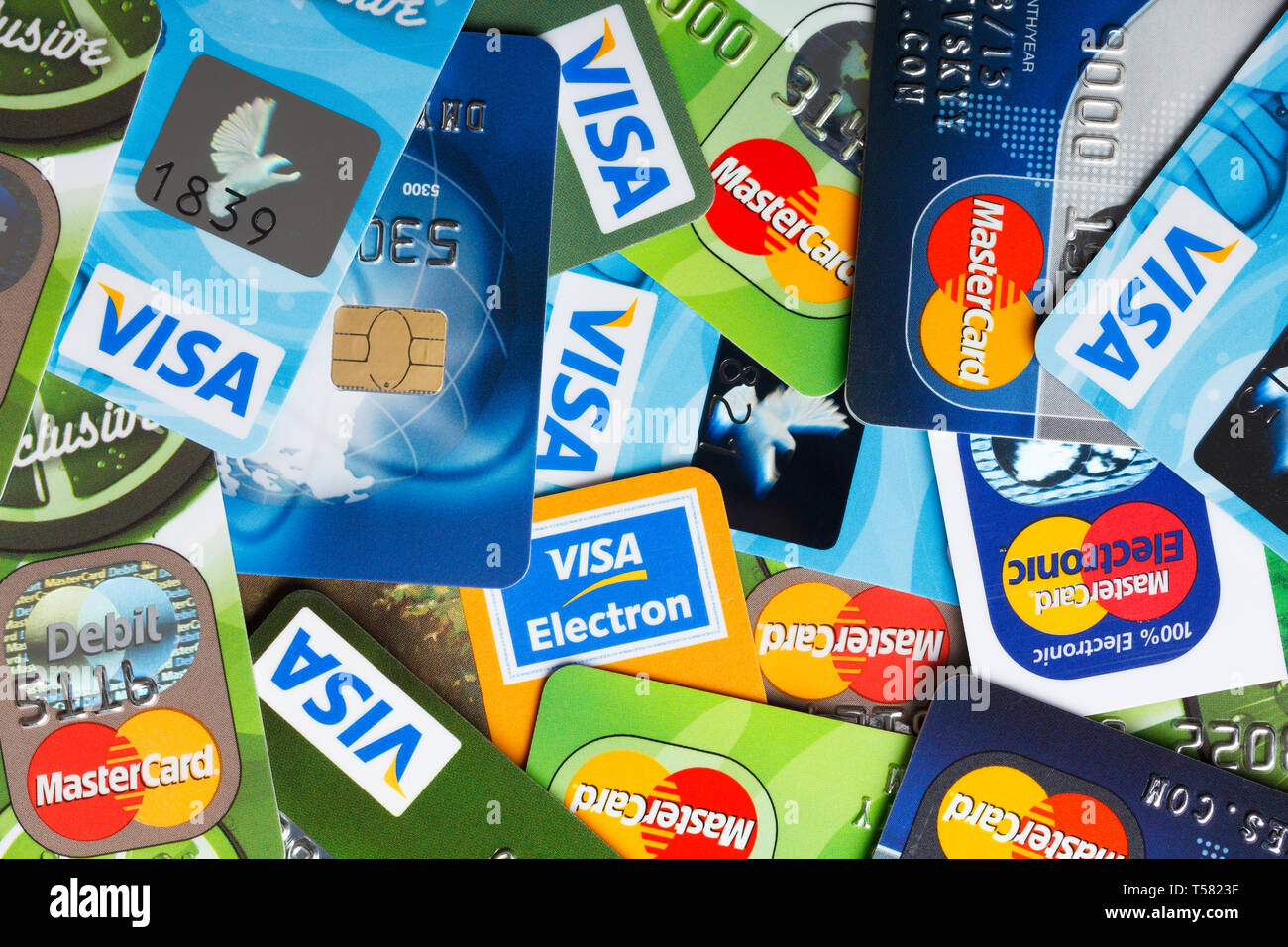 KIEV, UKRAINE - July 7: Pile of credit cards, Visa and MasterCard ...