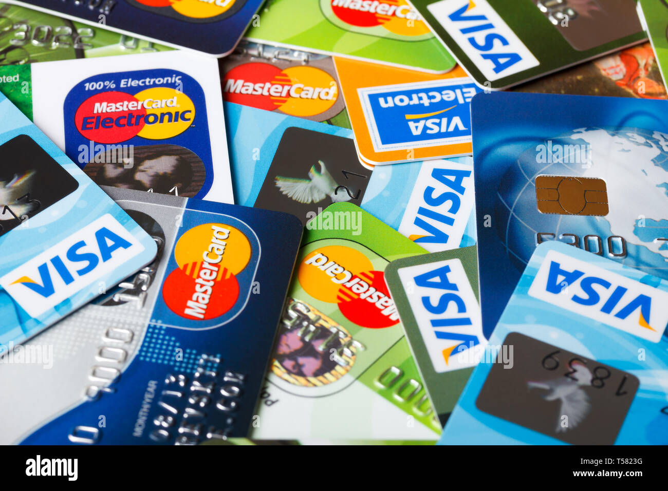 KIEV, UKRAINE - July 7: Pile of credit cards, Visa and MasterCard ...