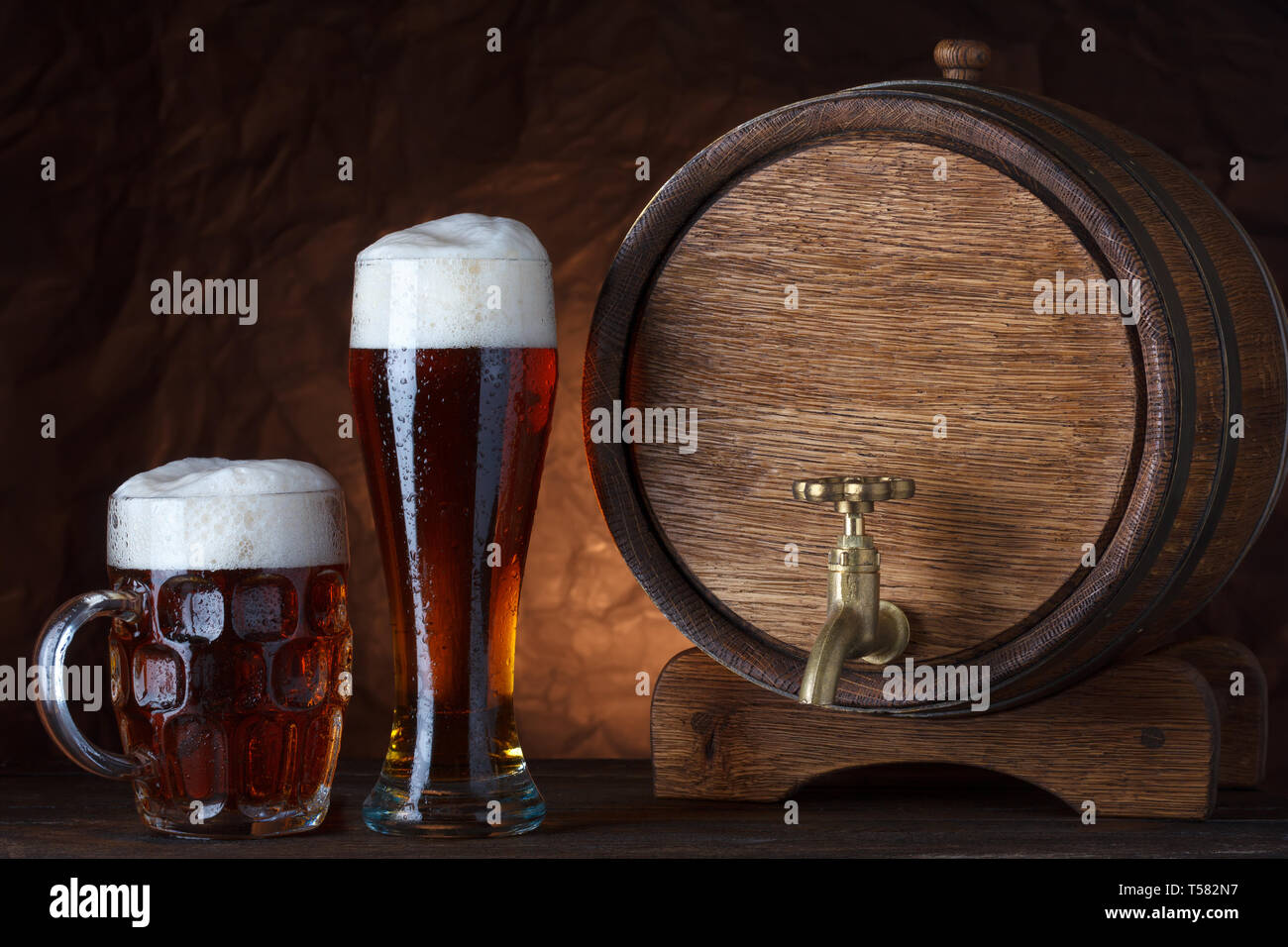 Beer glasses wooden barrel background hi-res stock photography and ...