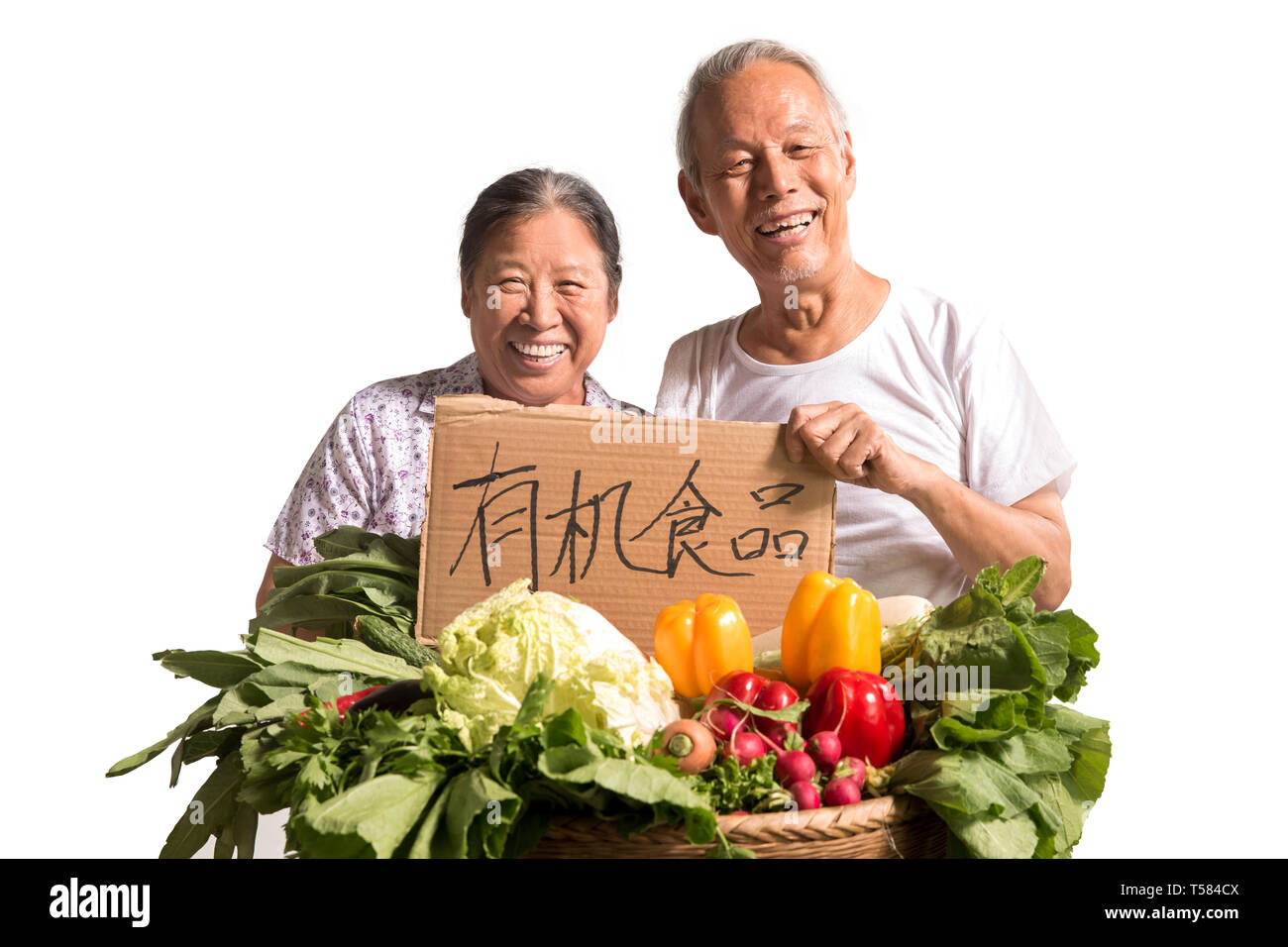 Peasant couple show their vegetables Stock Photo - Alamy