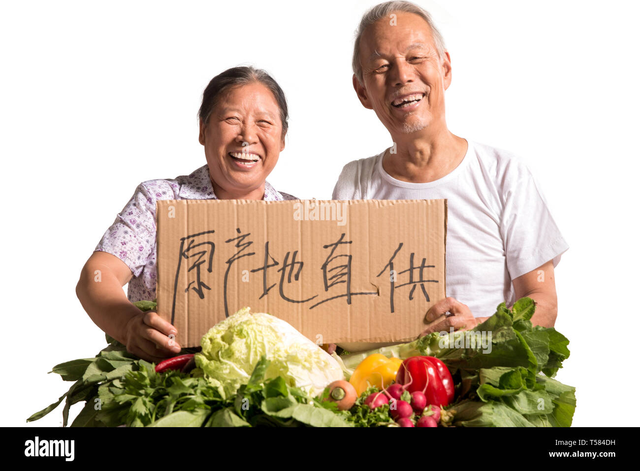Peasant couple show their vegetables Stock Photo - Alamy