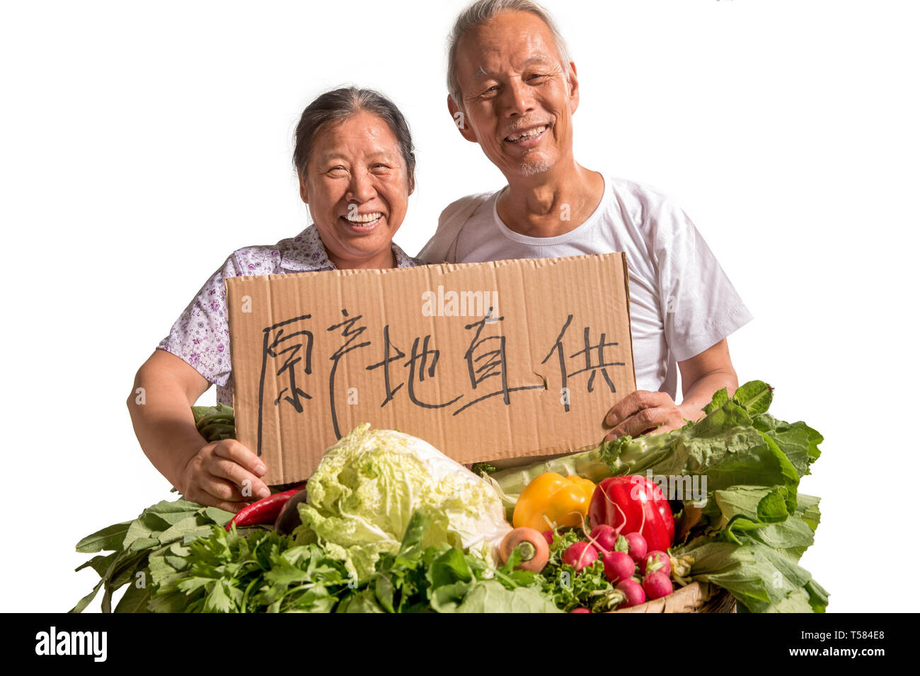 Peasant couple show their vegetables Stock Photo - Alamy