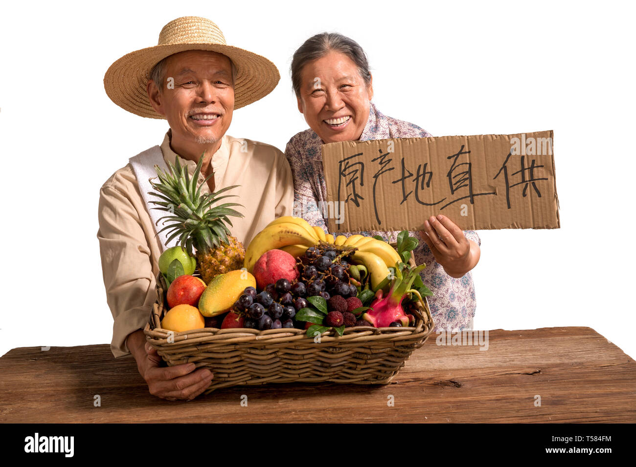 Peasant couple show their fruit Stock Photo - Alamy