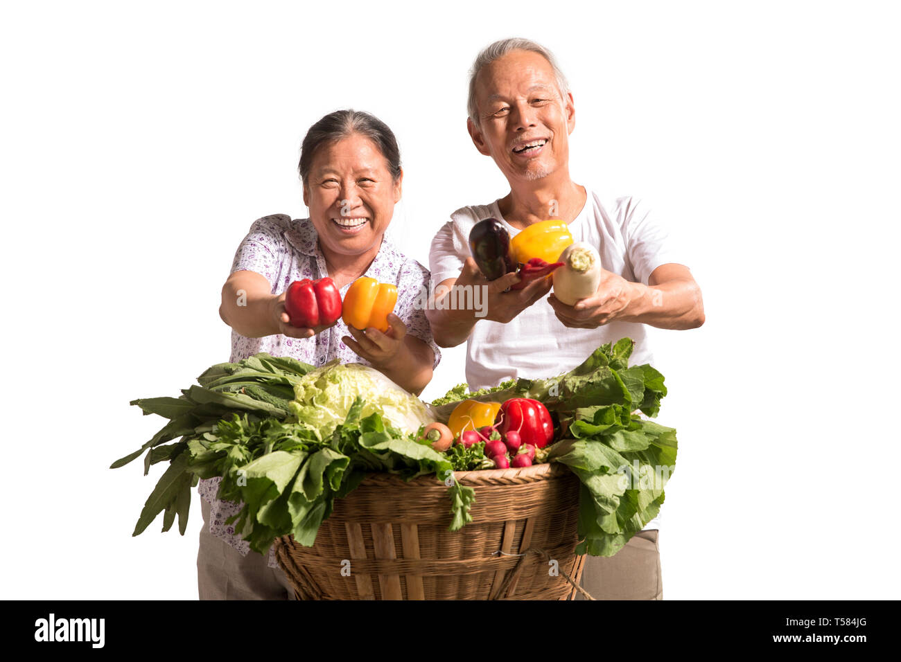 Peasant couple show their vegetables Stock Photo - Alamy