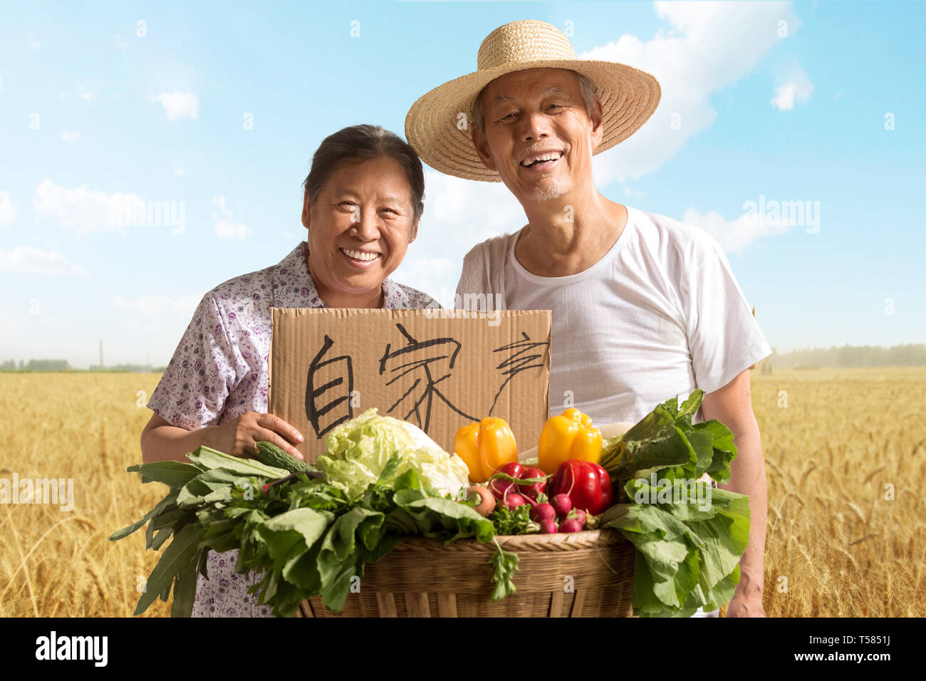 Peasant couple show their vegetables Stock Photo - Alamy
