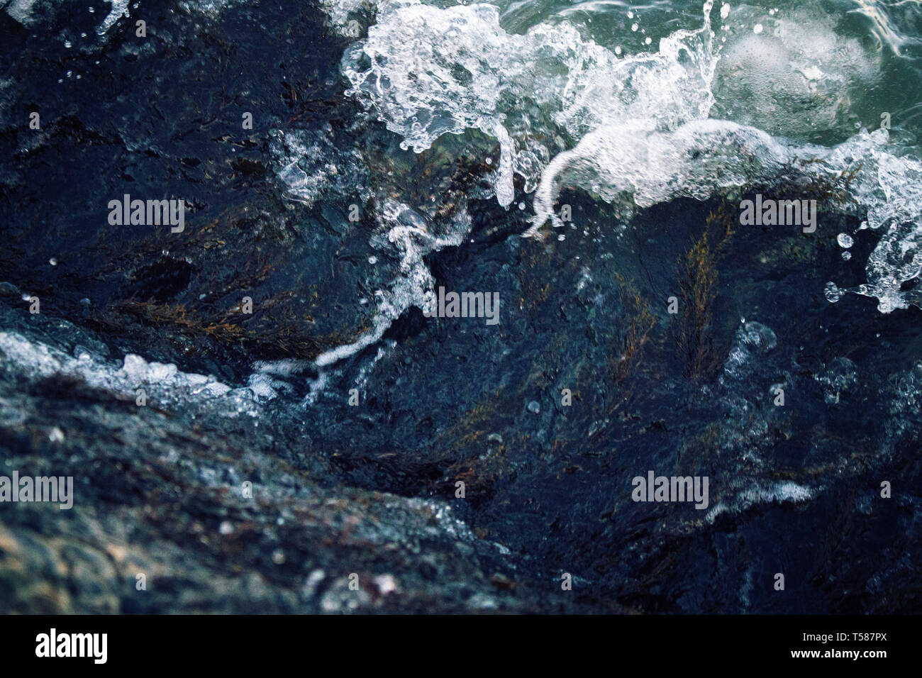 Oceanic waves during storm. Water roll forward and boils at shore ...
