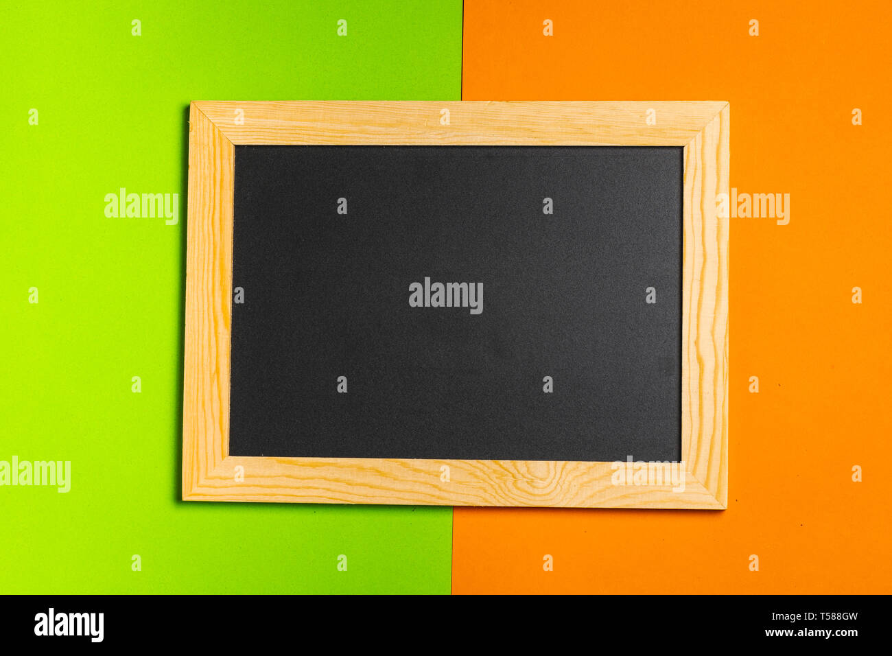 Top view of a chalkboard over vertical split bicolor background Stock ...