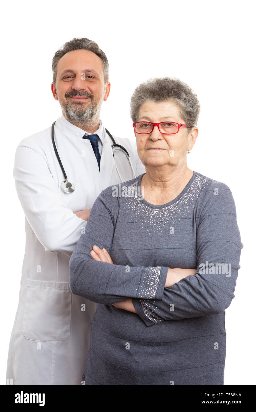 Portrait of smiling male doctor and serious female patient with crossed ...