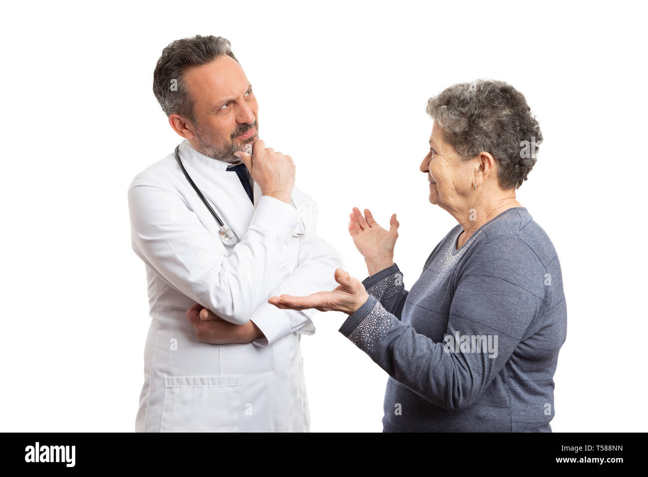 Elderly woman patient asking question and medic thinking about answer ...