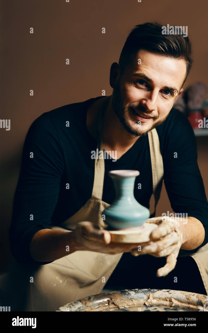 Caucasian male potter making ceramic hi-res stock photography and ...