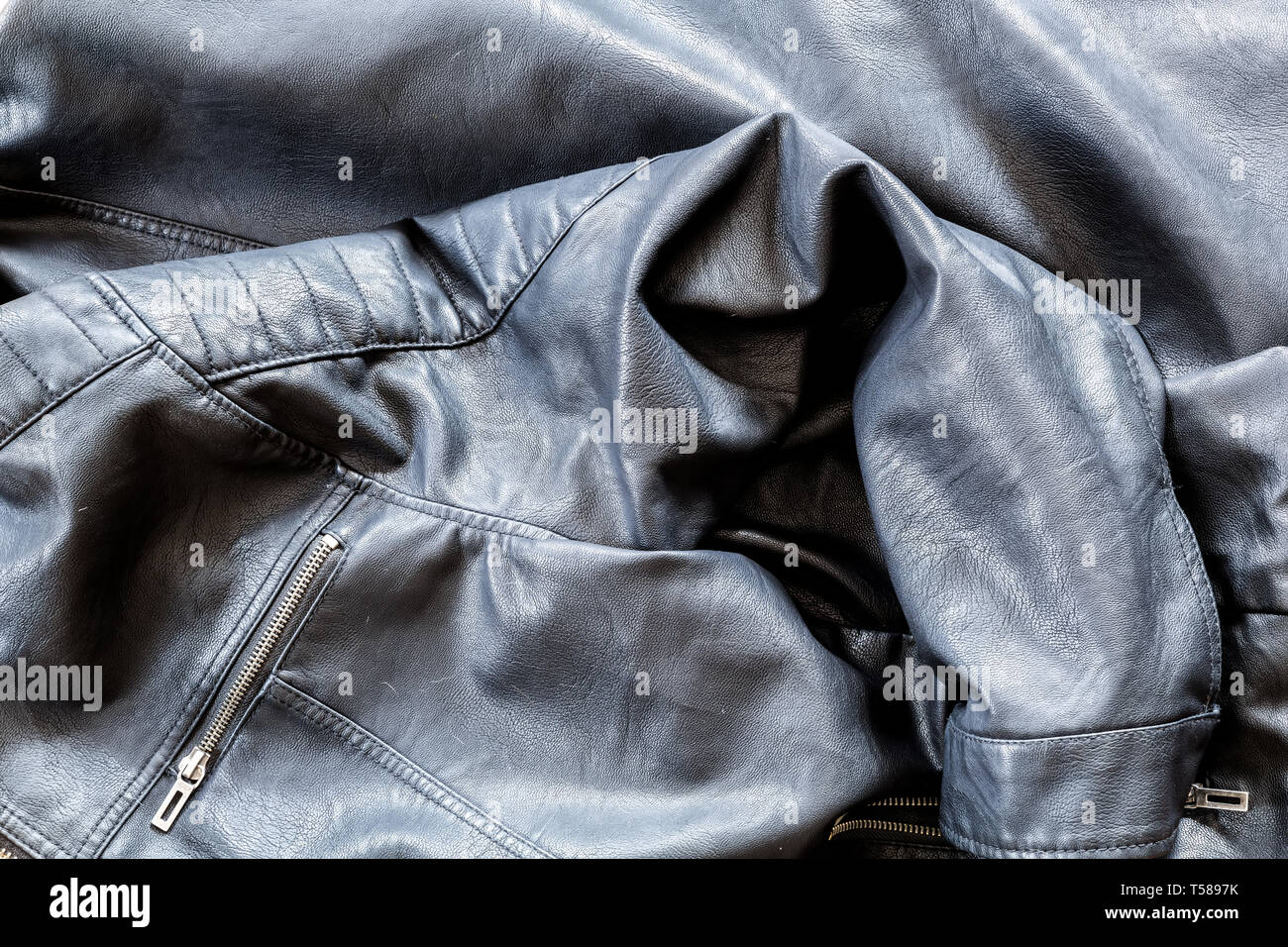 Stylish black leather jacket on the floor Stock Photo - Alamy