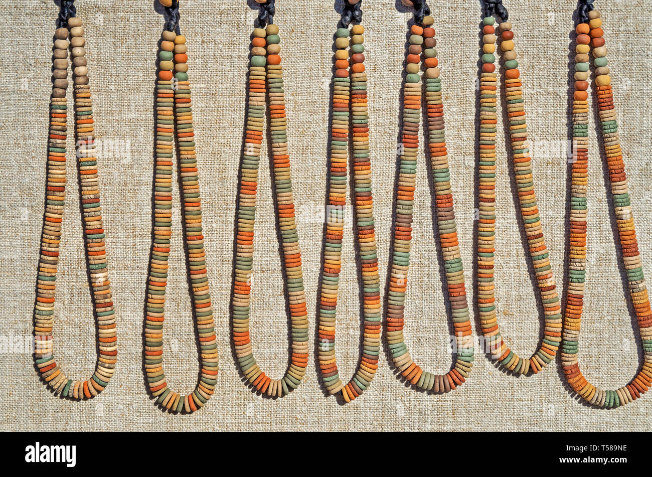 Primitive clay bead necklaces similar to those made by wild tribes in ...