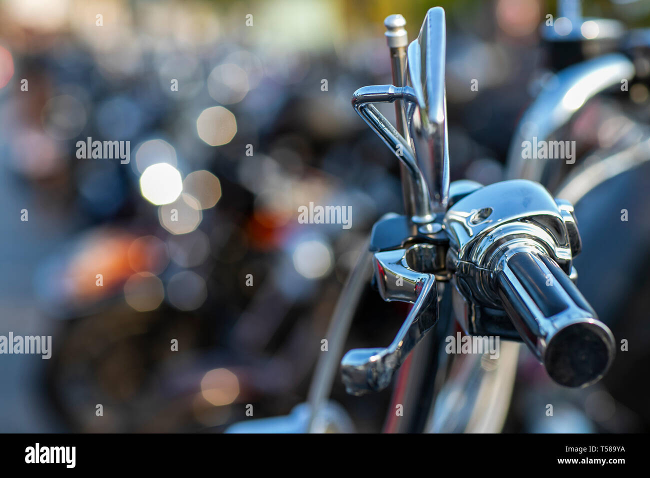 The chromed handlebar of a motorcycle. View of motorcycle handlebar in ...