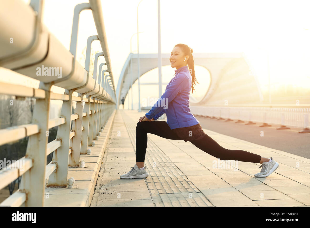 Outdoor fitness young woman Stock Photo - Alamy