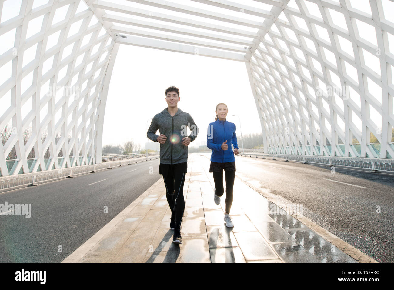 Exercise jogging determination bridge hi-res stock photography and ...