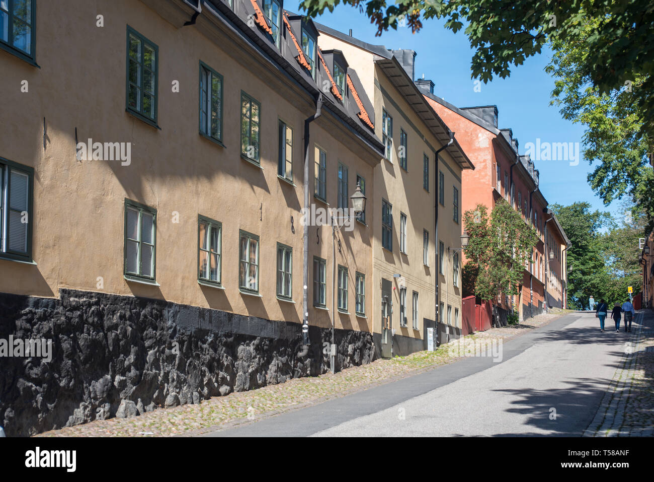 Colourful traditional houses line Yttersta Tvärgränd a pedestrianised ...