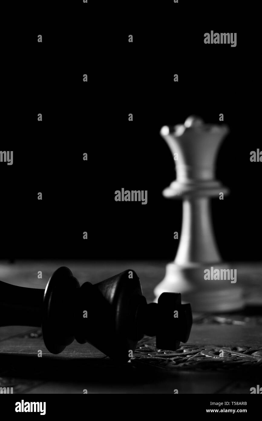 Chess board and pieces representing power and greed Stock Photo - Alamy