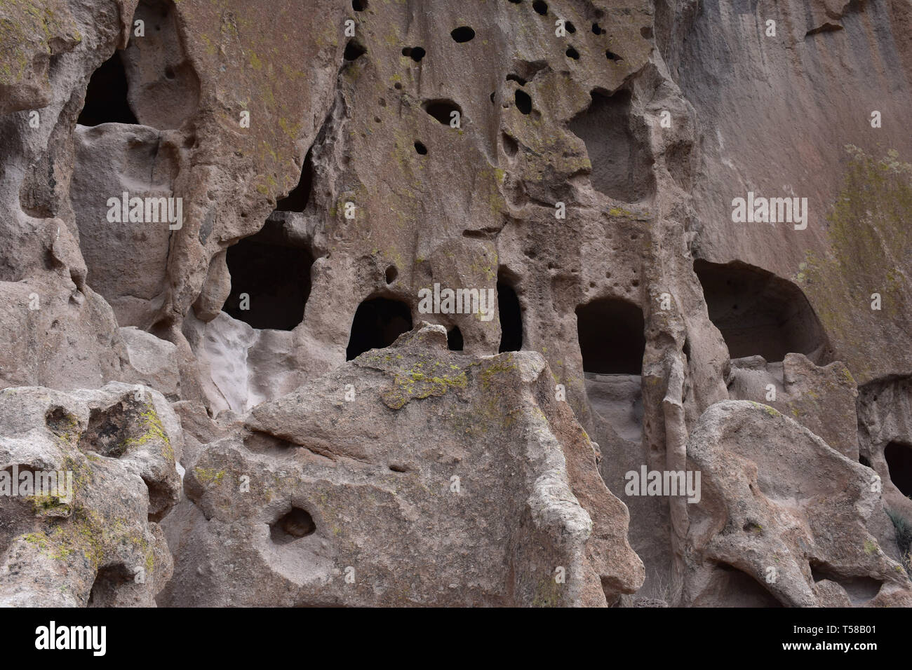 Caves and caverns carved out of the sandstone cliffs Stock Photo - Alamy