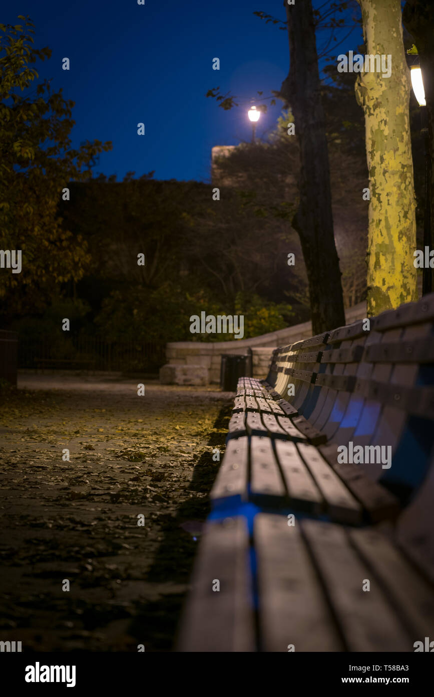 Empty park benches on a quiet Autumn night, Carl Schurz Park, New York ...
