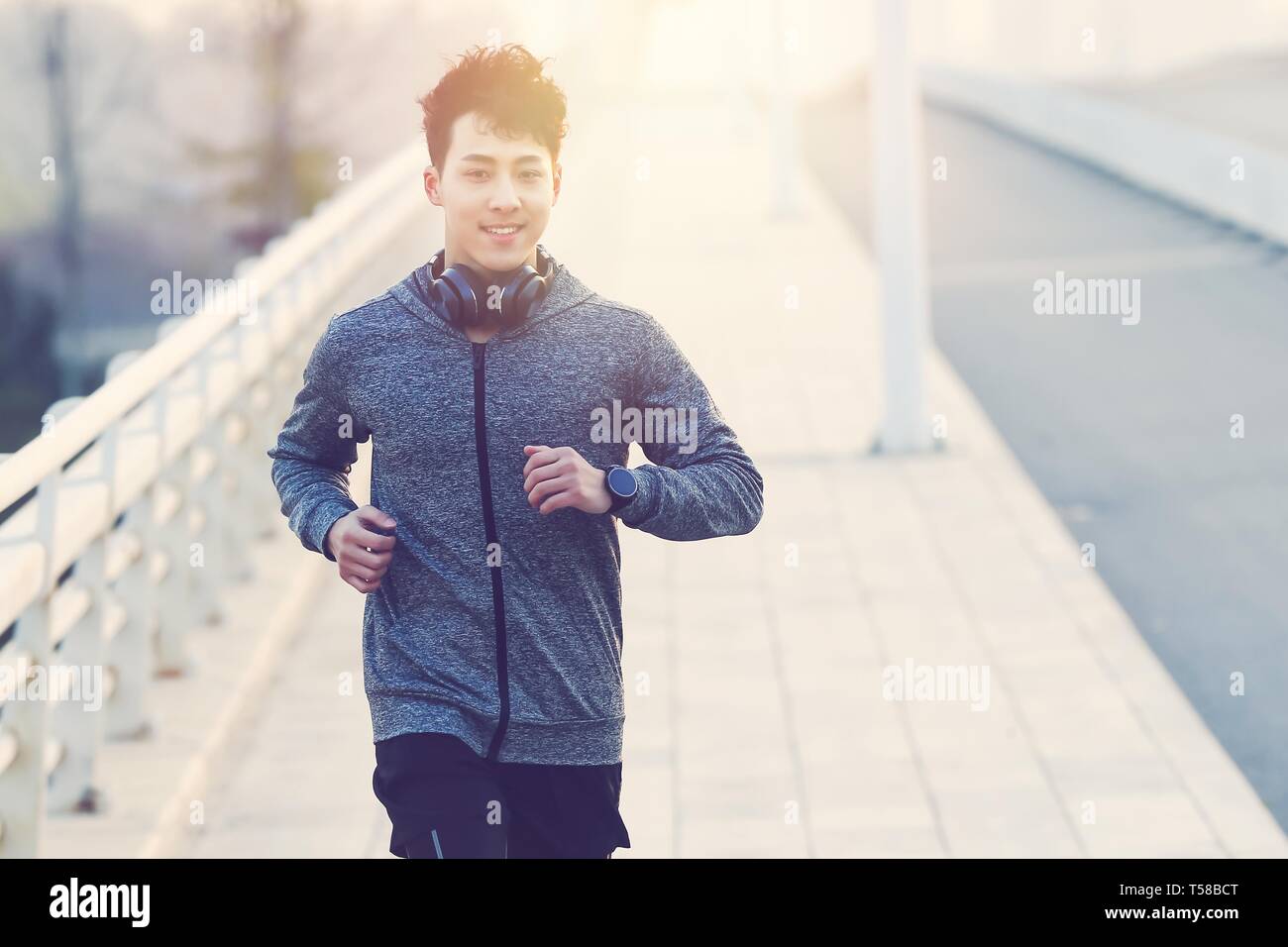 Young men outdoor jogging Stock Photo - Alamy