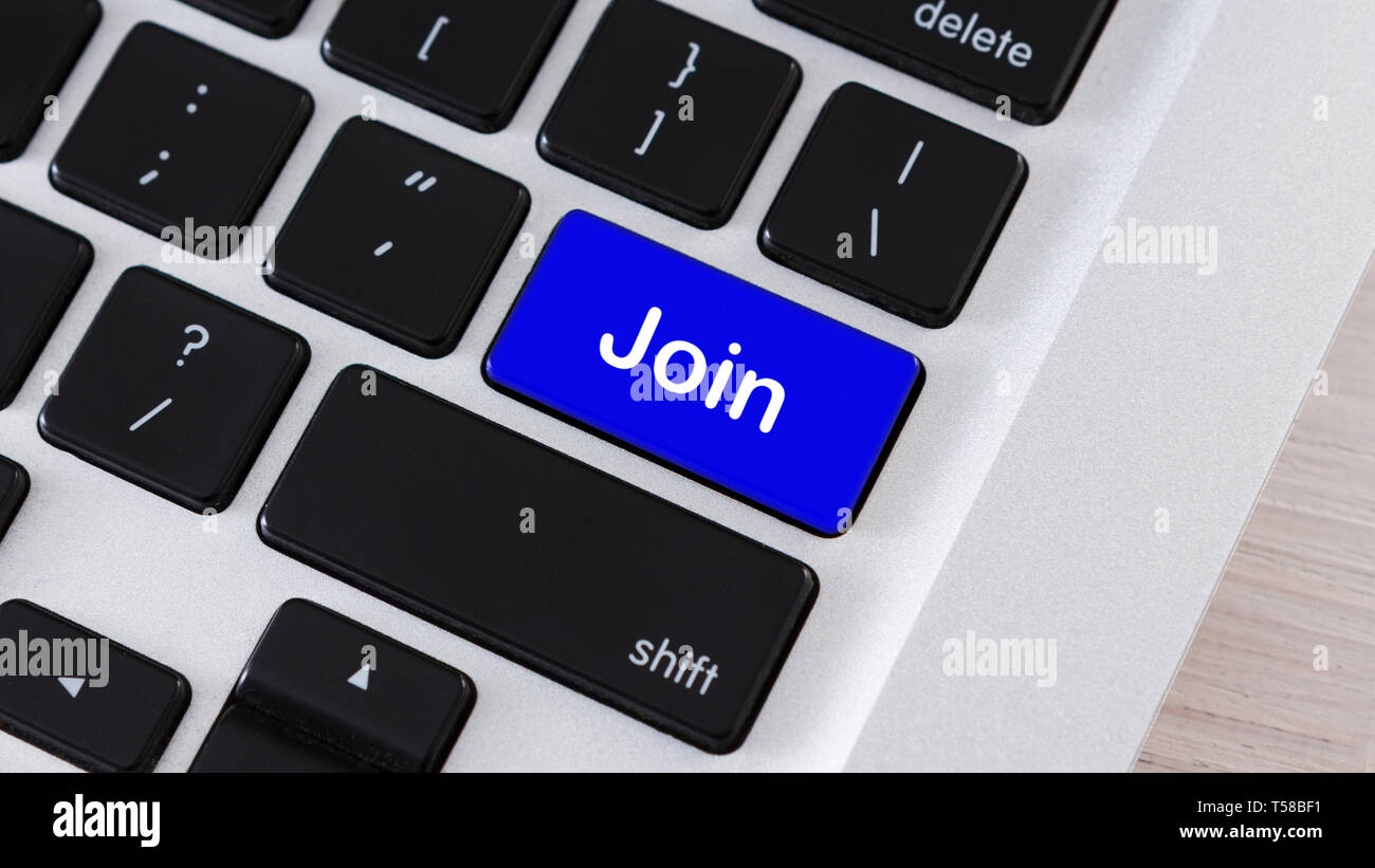 Blue button with text Join on laptop keyboard Stock Photo - Alamy