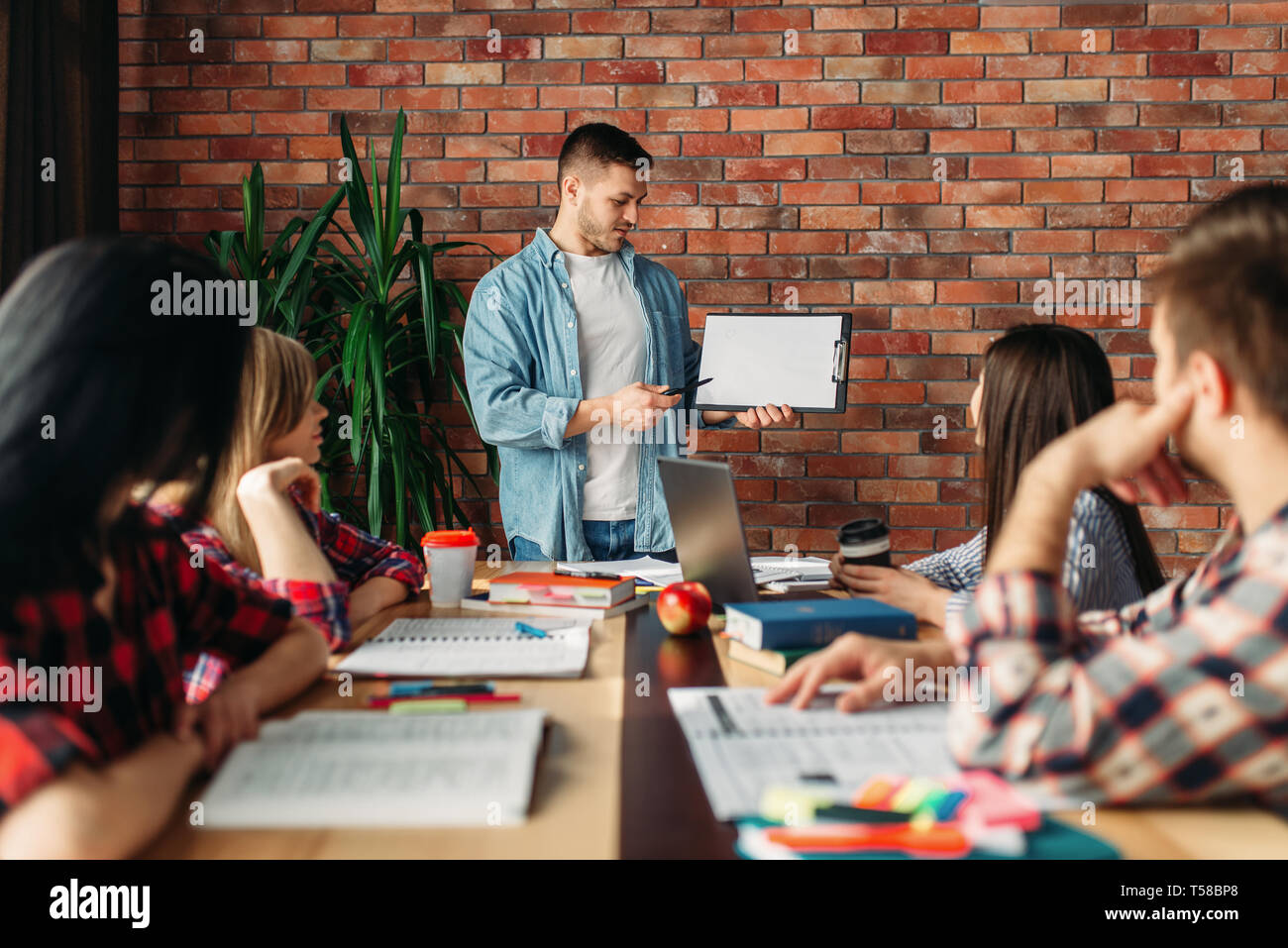 Group of students watching for new presentation Stock Photo - Alamy