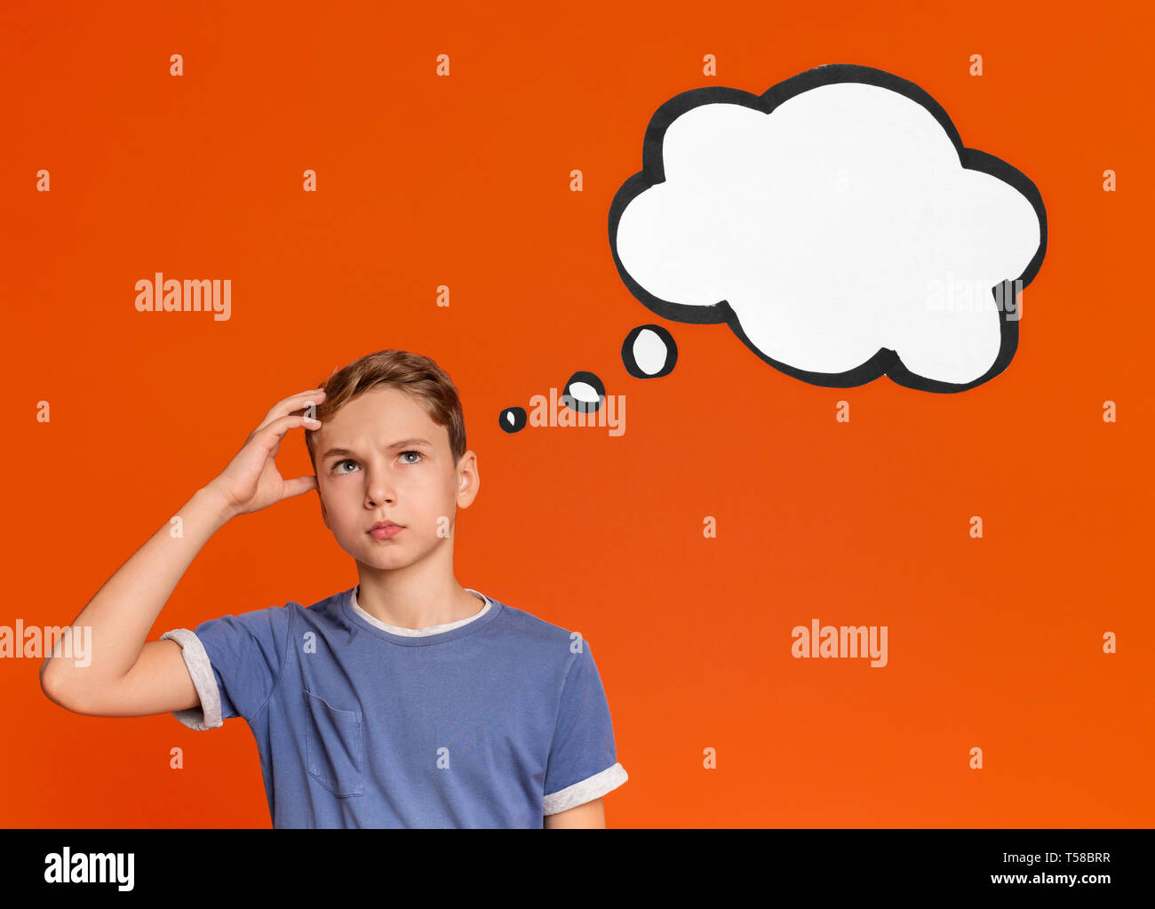 Puzzled teen boy scratching his head and thinking Stock Photo - Alamy