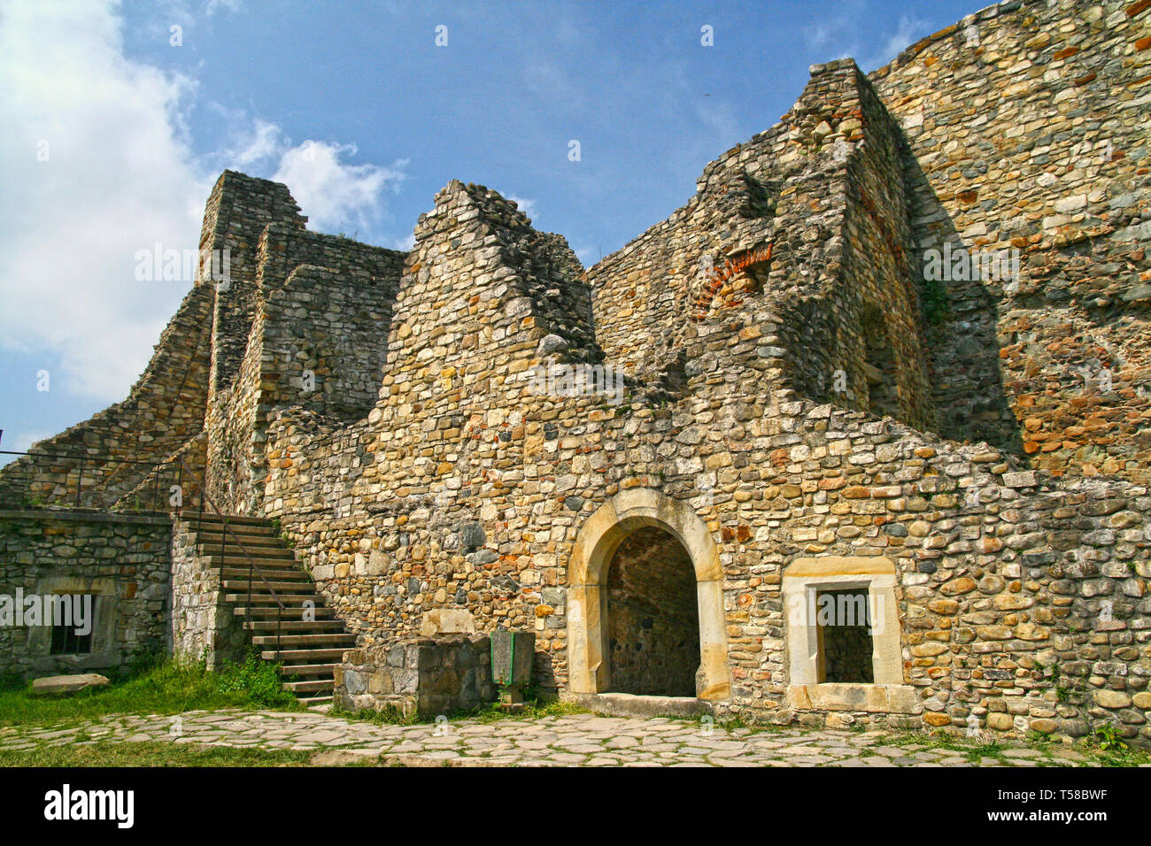 Neamt fortress ruins, ancient stone walls and room entrance Stock Photo ...