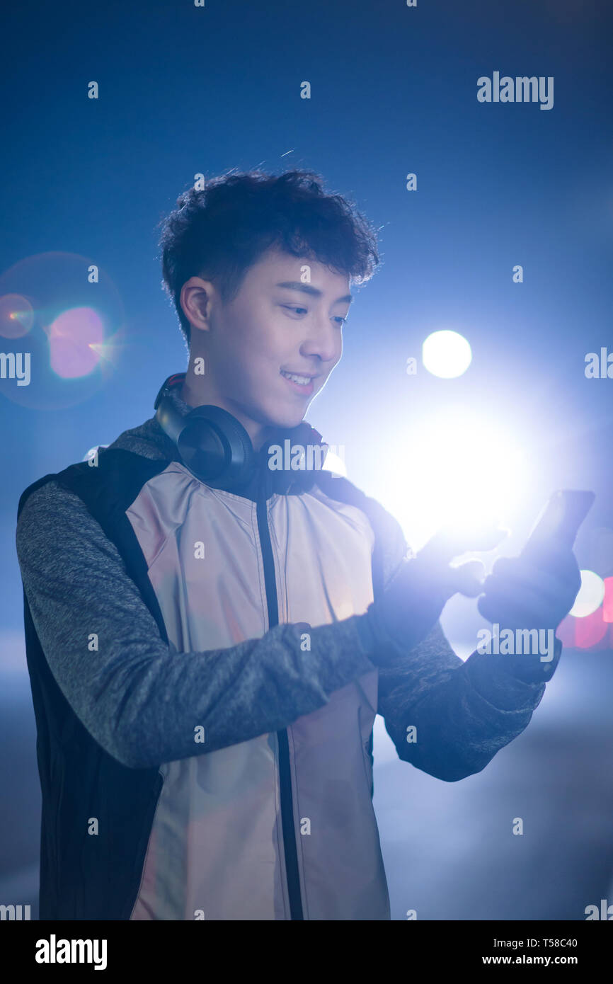 Young man jogging night hi-res stock photography and images - Alamy