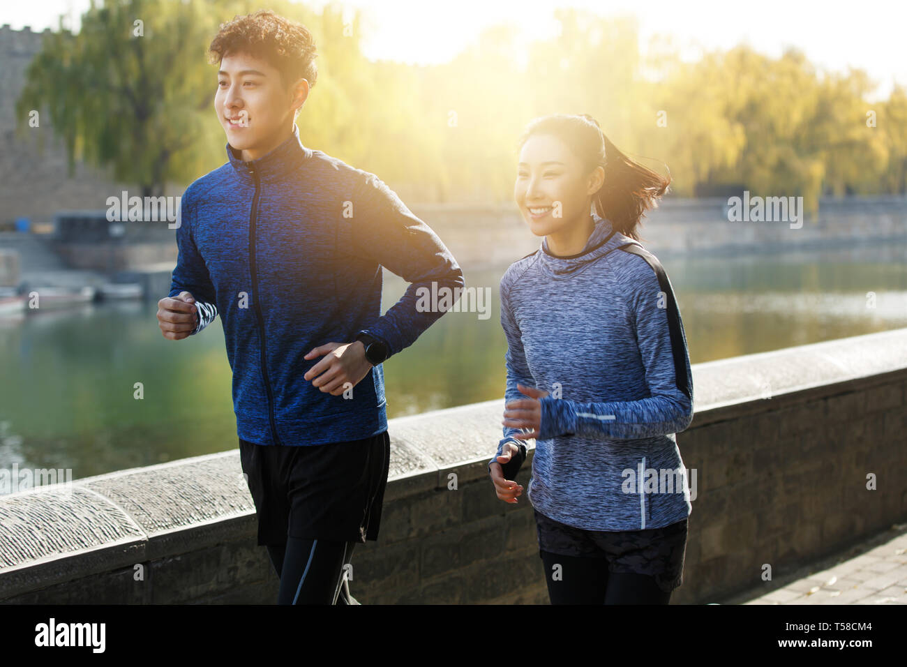 Young asian chinese couple jogging hi-res stock photography and images ...