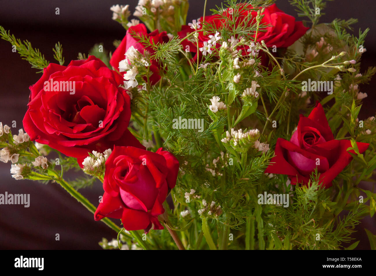Beautiful red roses bouquet in nature Stock Photo - Alamy