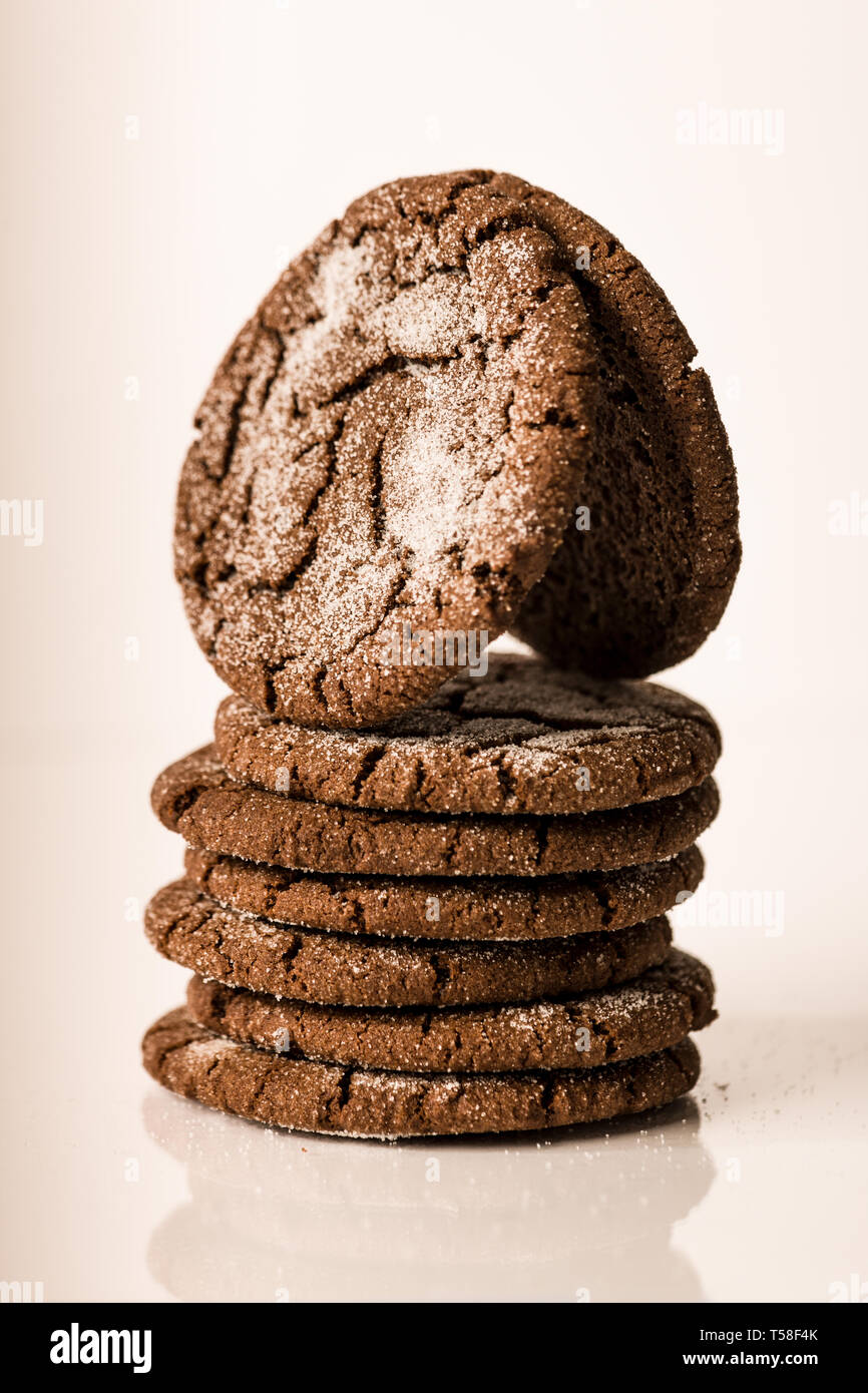 Stacked chocolate sugar cookies, with two balancing on top Stock Photo ...