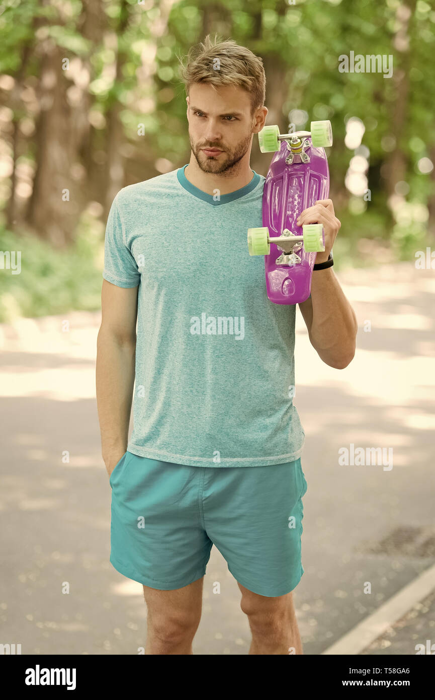 He will show his best in skateboarding. Guy carries penny board ready ...
