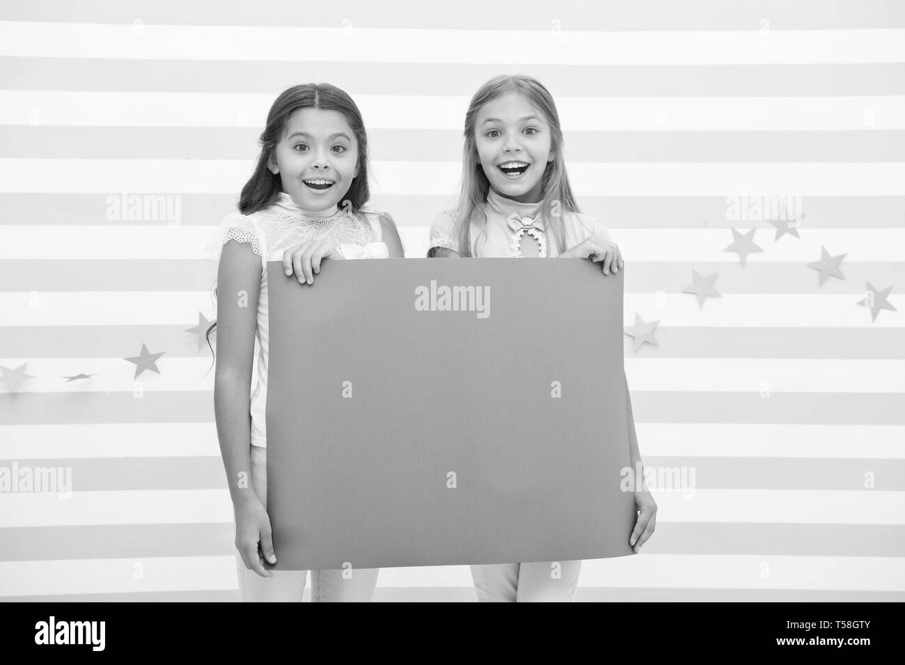 Girls kids hold advertisement poster copy space. Children hold ...