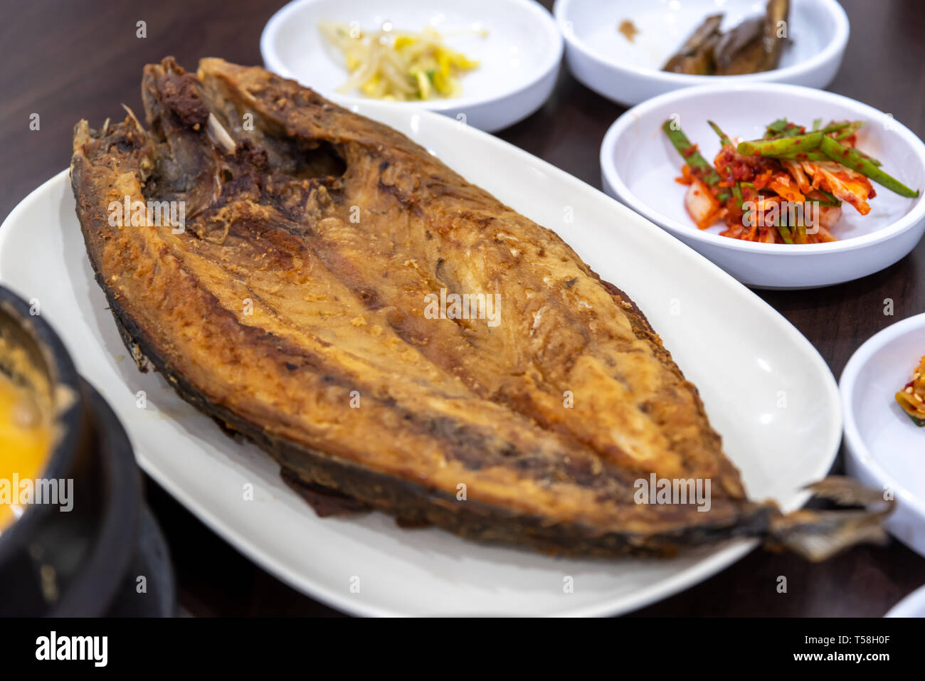 Korean style Grilled mackerel with side dish on the table Stock Photo ...