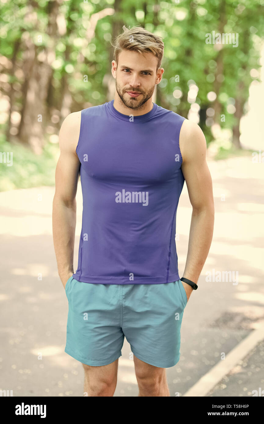 Enjoy wellbeing and healthy body. Man sporty outfit looks confident ...