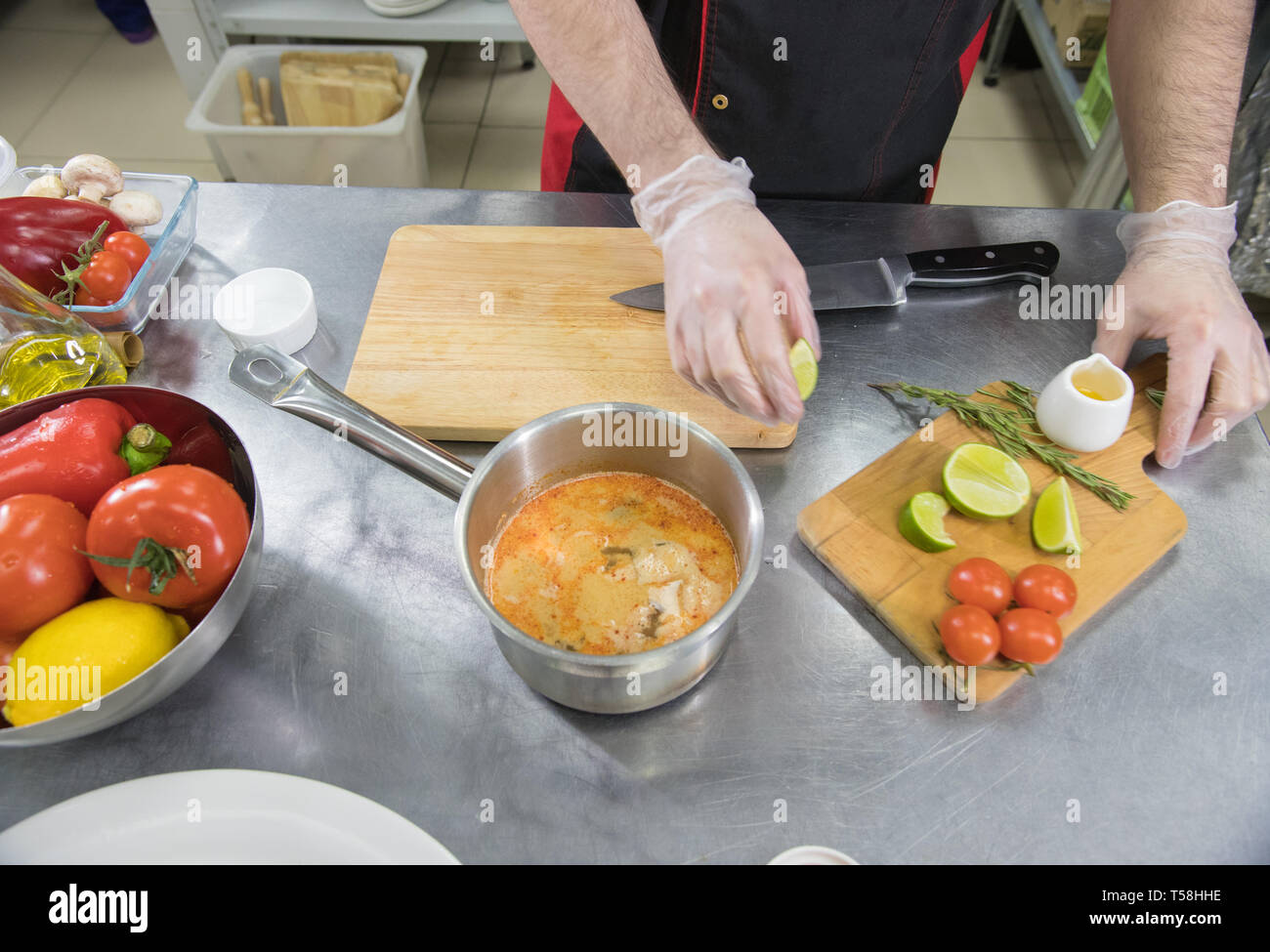 Chef adding ingredients in soup hi-res stock photography and images - Alamy