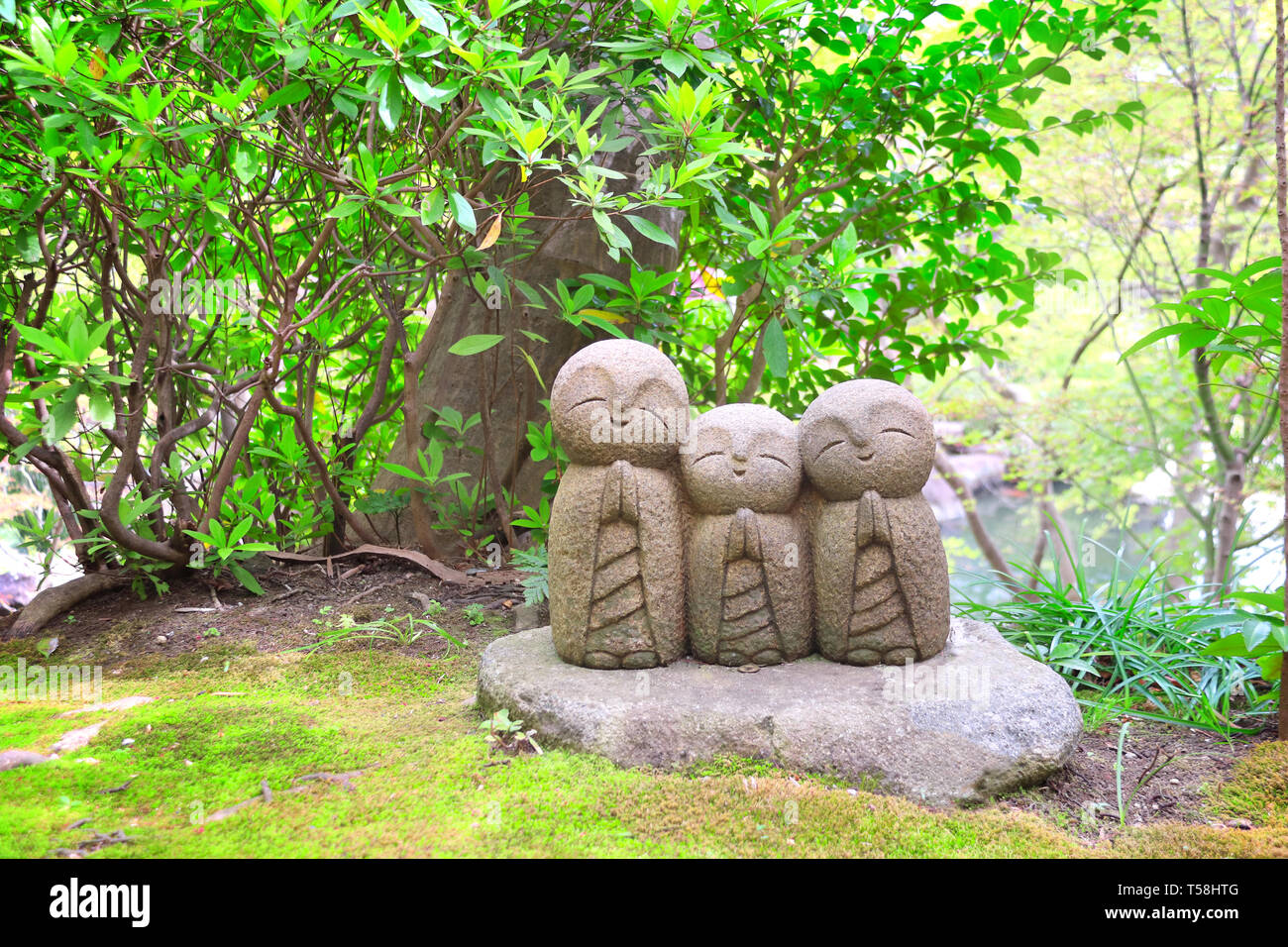 Stone statue of three smiling Jizo (Jizo Bosatsu), Hasedera temple ...