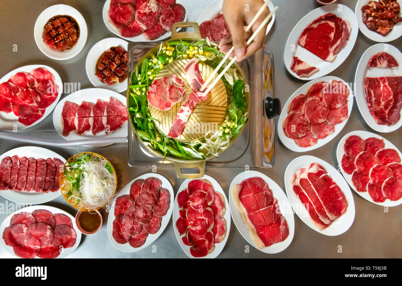 Asian BBQ-Style. Grill sliced beef on hot pan with vegetable Stock ...