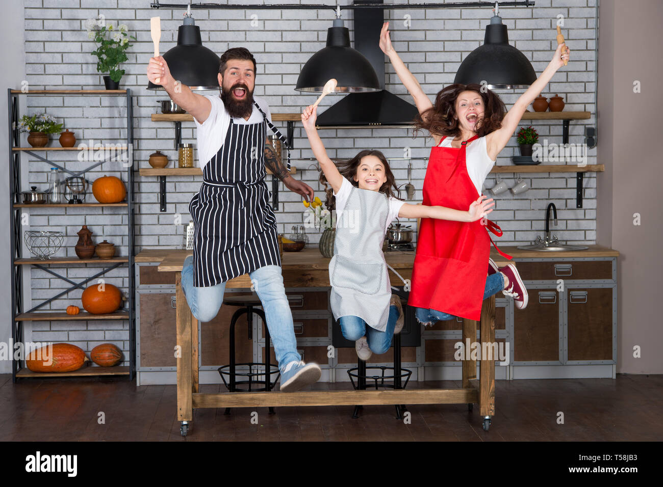 Family having fun cooking together. Teach kid cooking food. Weekend ...