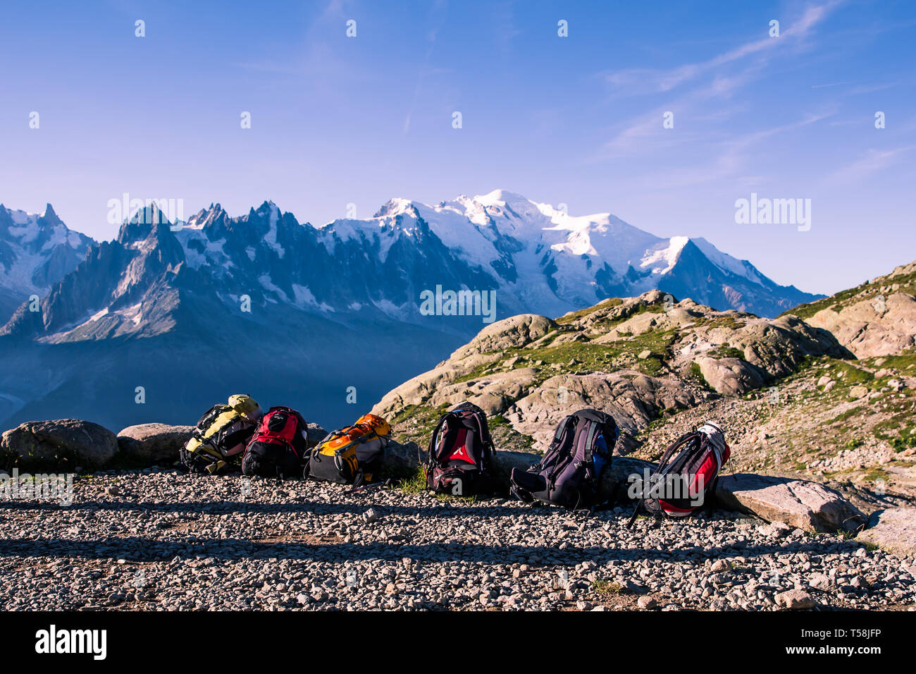 Group standing in front of mountains hi-res stock photography and ...